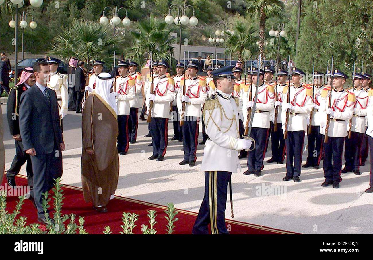 Syrian President Bashar Assad, left wearing a suit, and visiting Saudi Crown Prince Abdullah bin ...